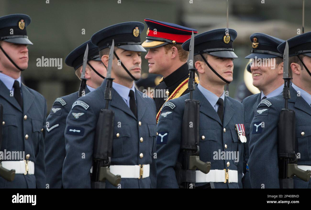 Britain's Prince Harry, Honorary Air Commandant, center, inspects No 26 ...