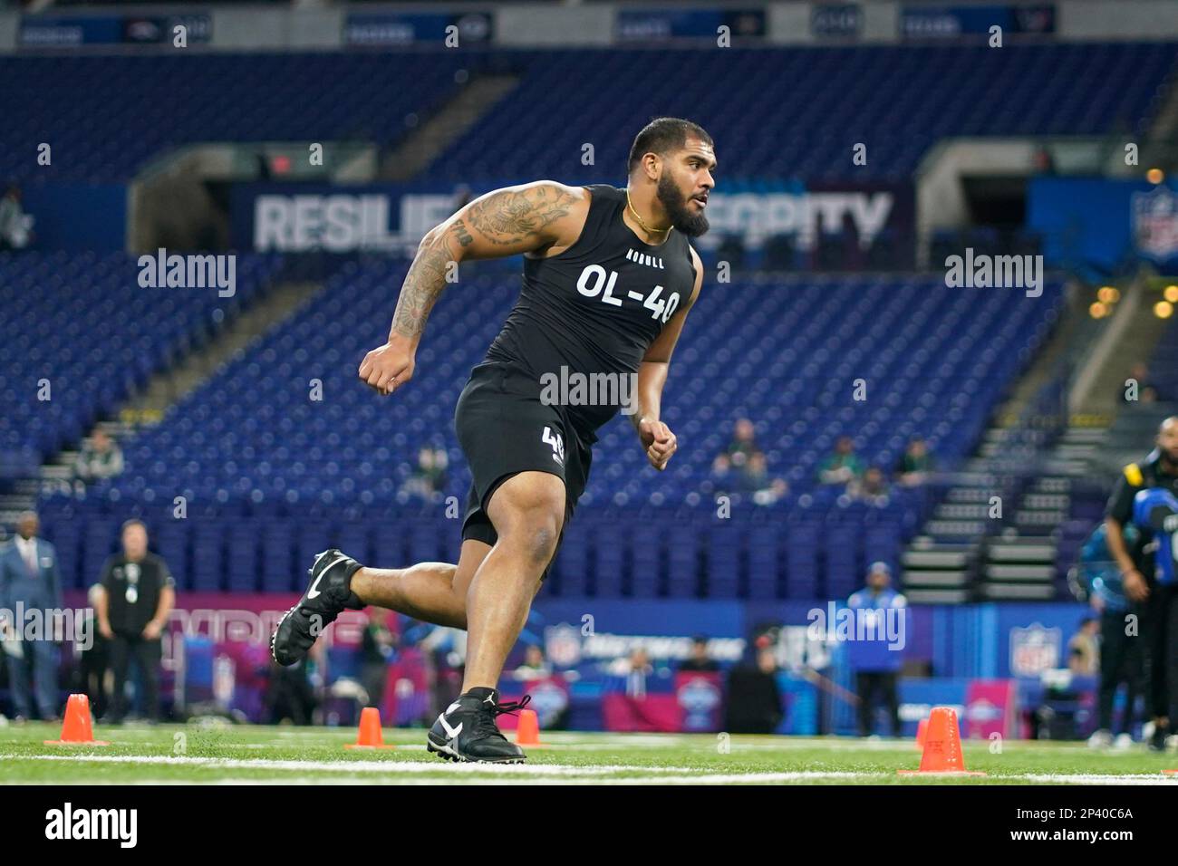 Penn State offensive lineman Juice Scruggs runs a drill at the NFL ...