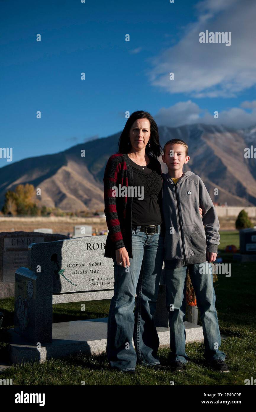 Lorraine Mason and her son Jasper Robinson pose for a portrait next to ...