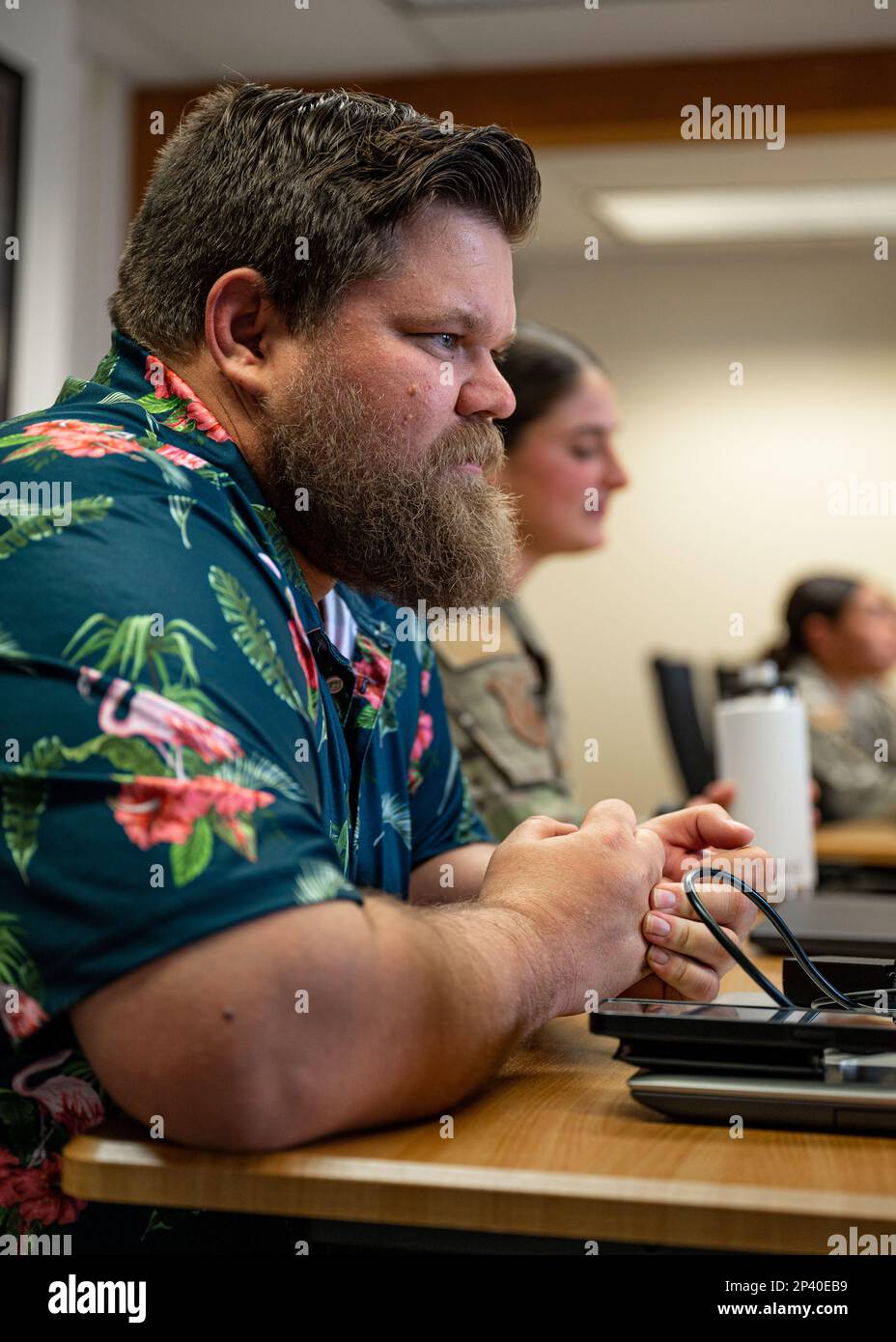 Brian Fattor, 58th Maintenance Squadron unit program manager, listens ...