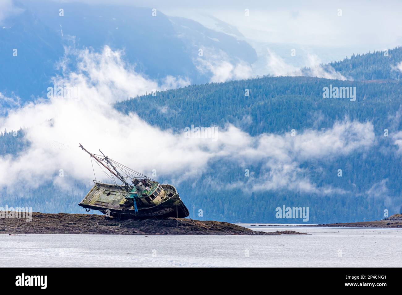 A shipwreck lying on its side during low tide in Behm Canal, Southeast ...