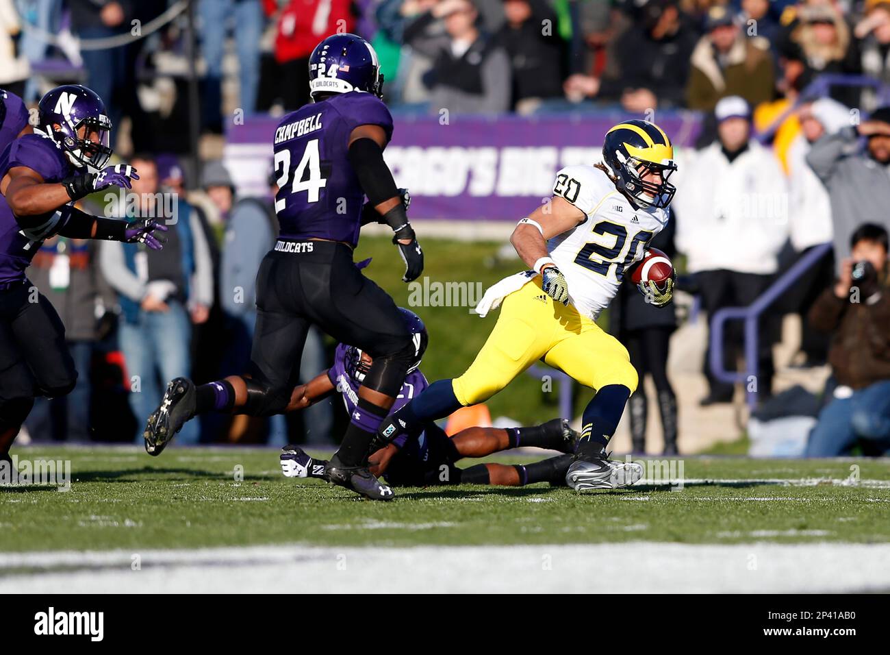 Michigan running back Drake Johnson (20) runs with the football during ...