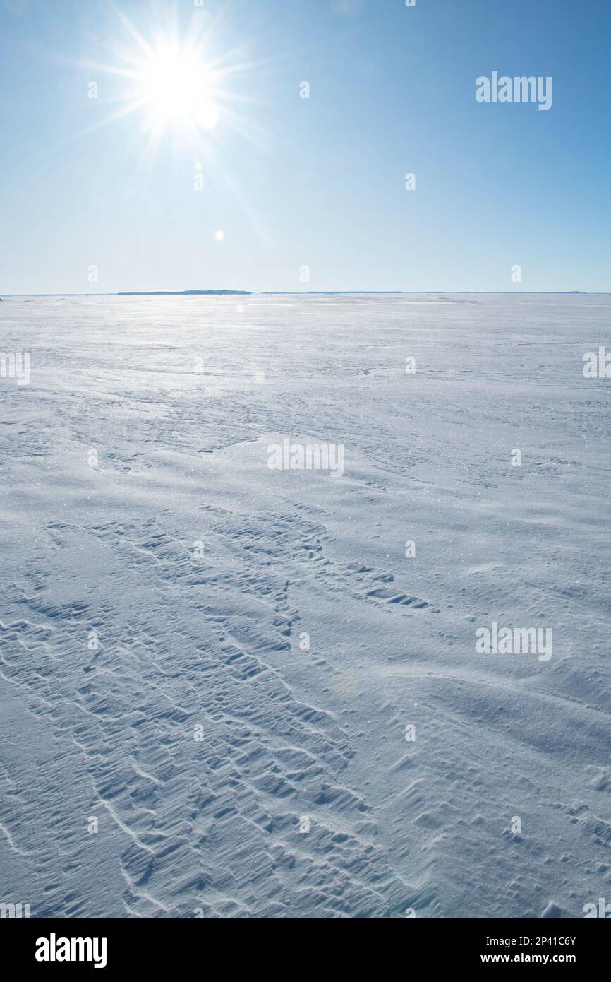Antarctica, Amundsen Sea, Siple Island. Sunburst over frozen sea ice ...