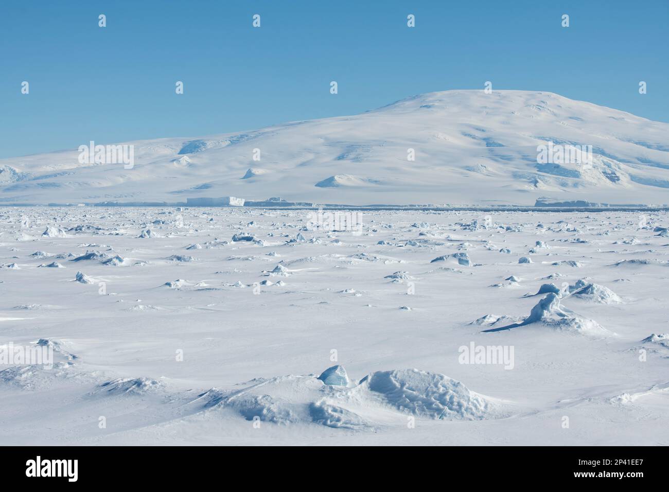 Antarctica, Amundsen Sea, Siple Island. Sea ice with Mount Siple ...