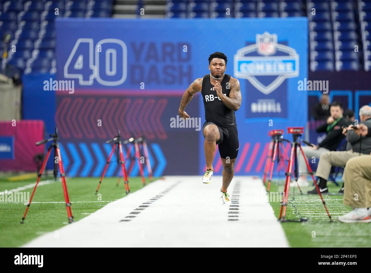 Louisville running back Tiyon Evans runs a drill at the NFL football ...