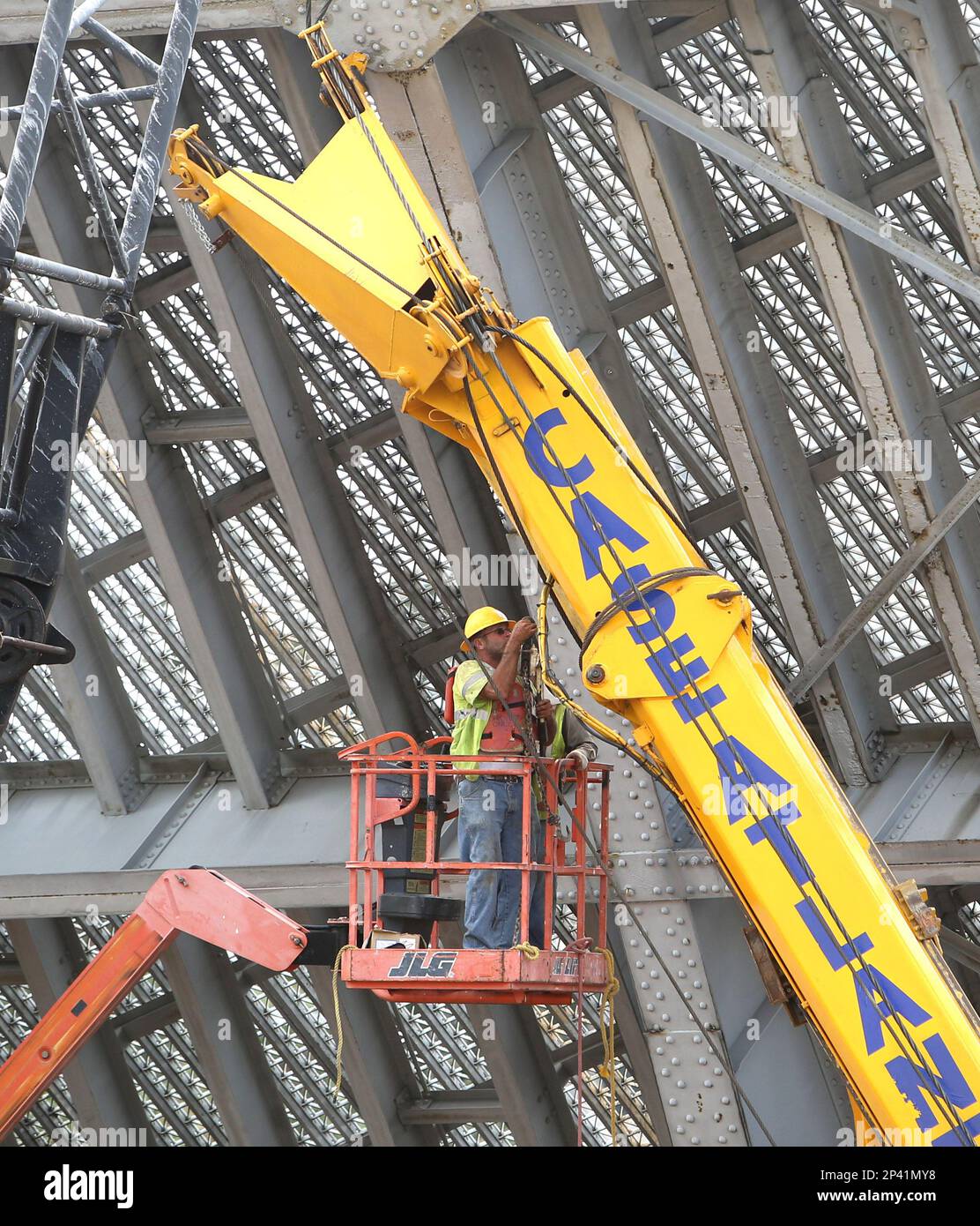 After pressure was eased on the cables of a 50-ton drilling rig, crews ...