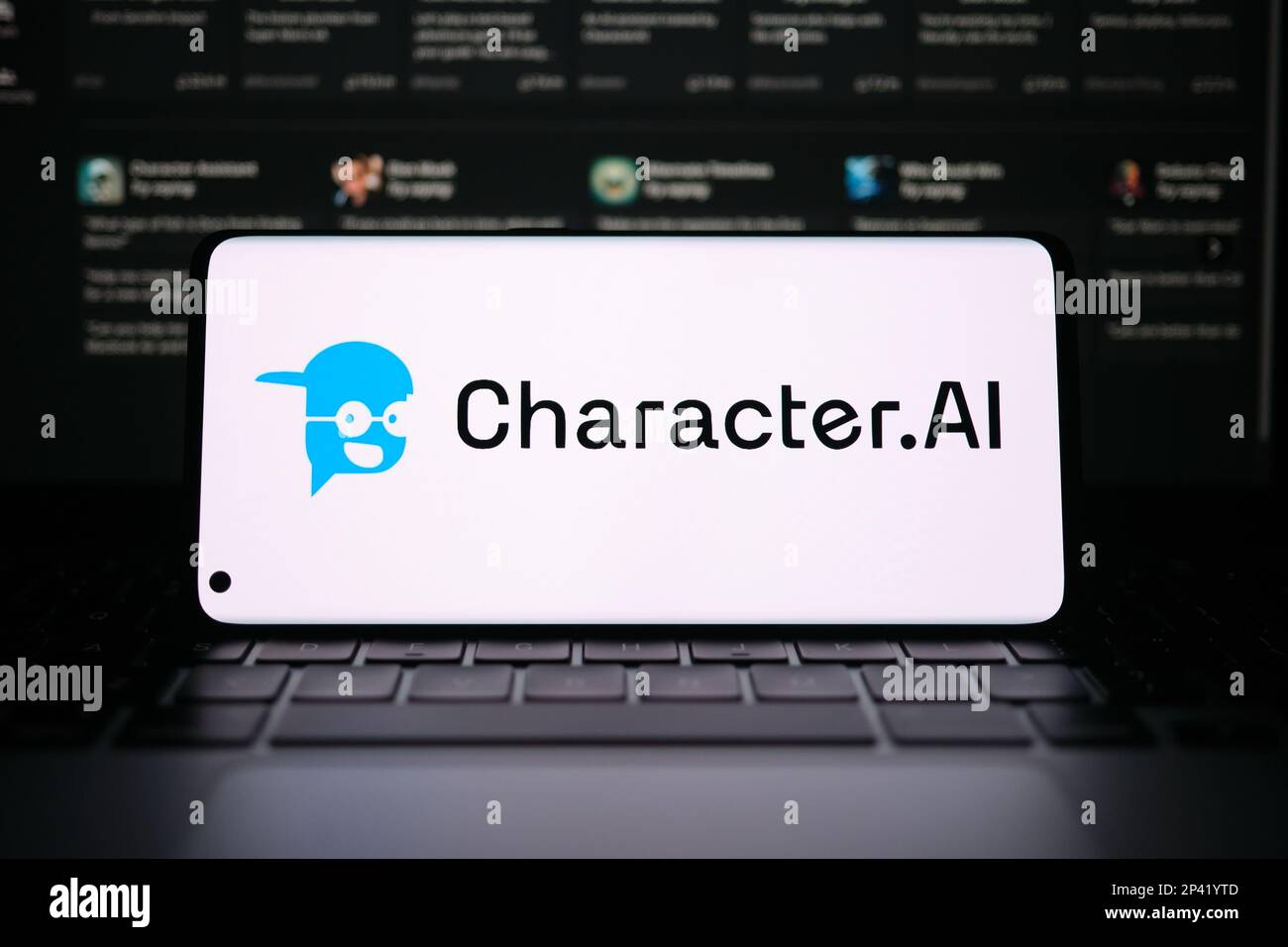 Character AI logotype seen on smartphone screen. Blurred Character.AI ...