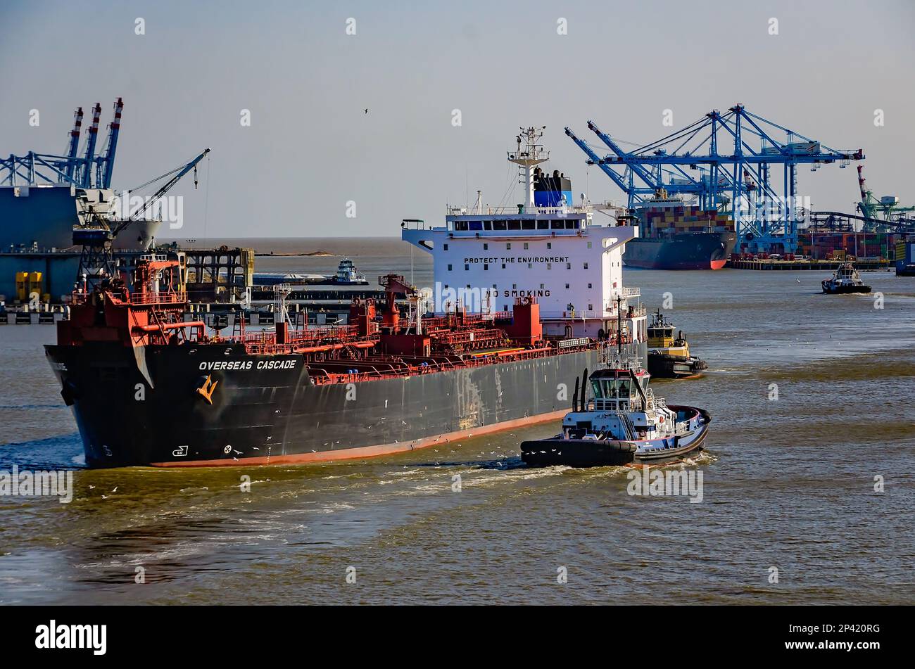 Overseas Cascade is pictured as it enters the Port of Mobile assisted ...
