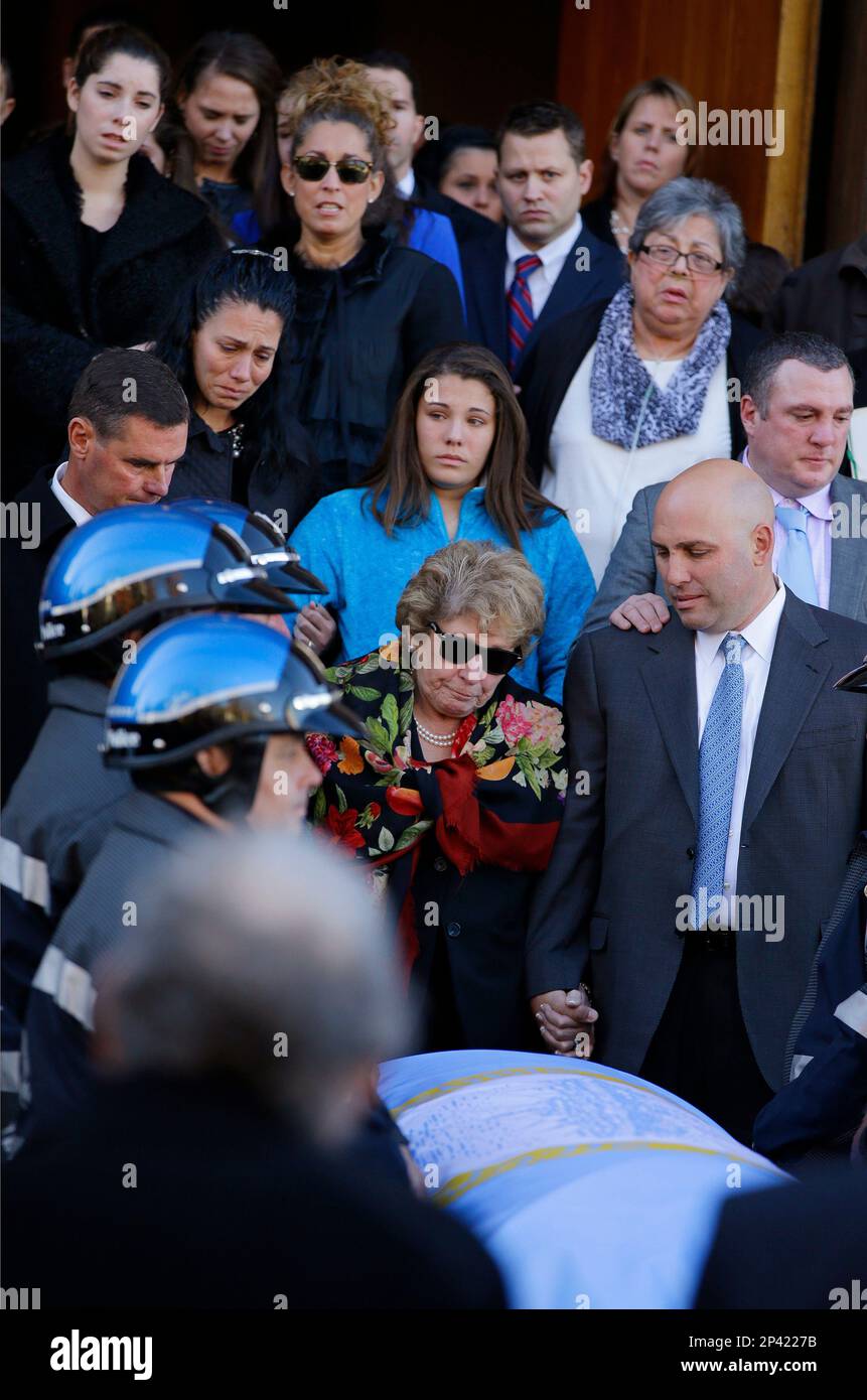 Angela Menino, center, stands behind her husband's casket, former ...