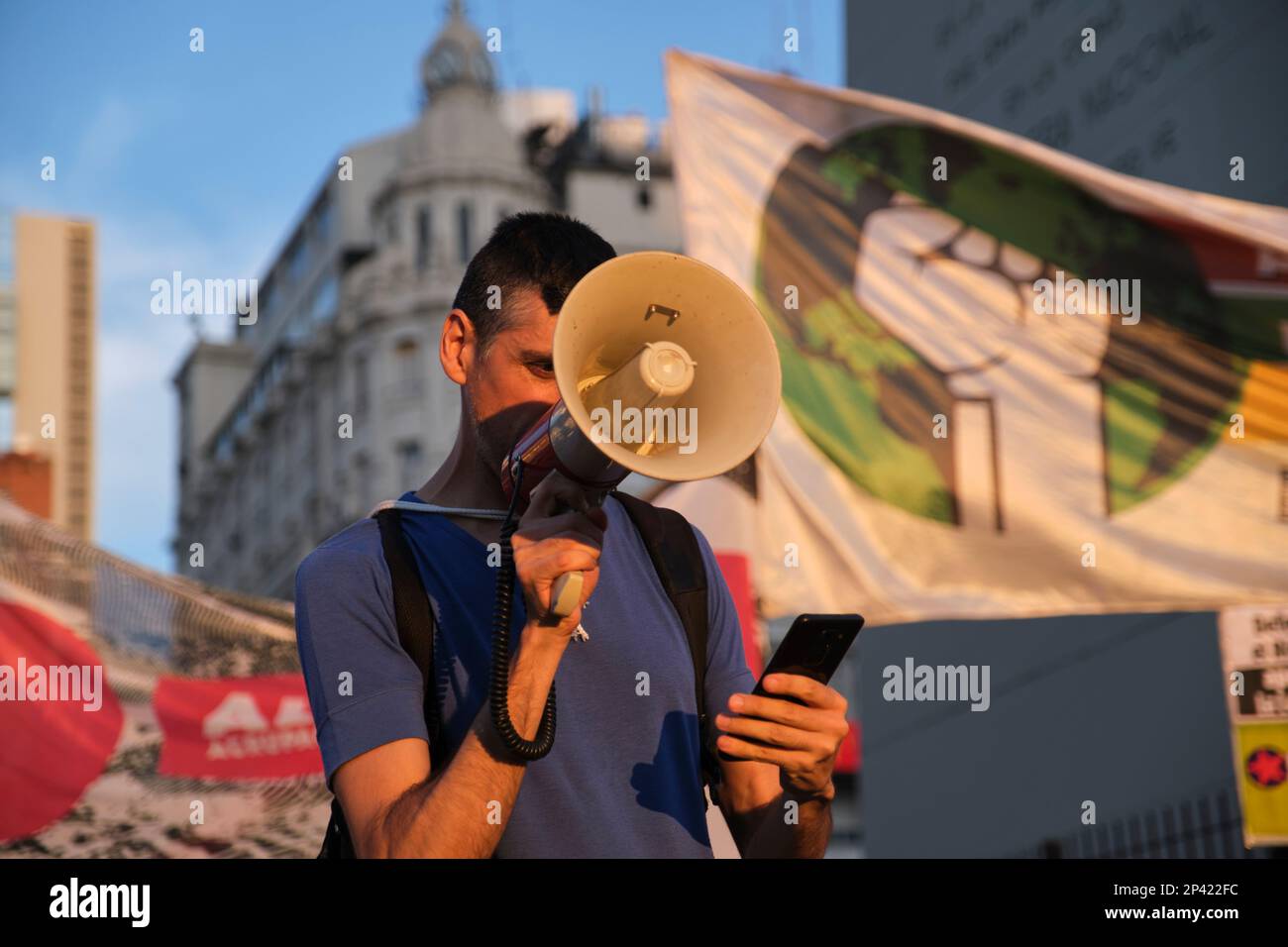 Buenos Aires, Argentina; March 3, 2023: Activist with a megaphone ...