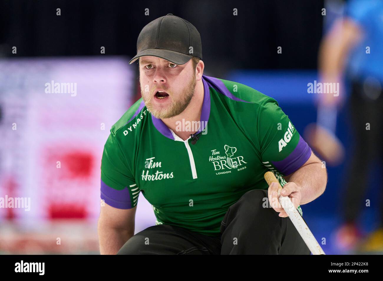 Prince Edward Island skip Tyler Smith calls to his sweepers during his ...