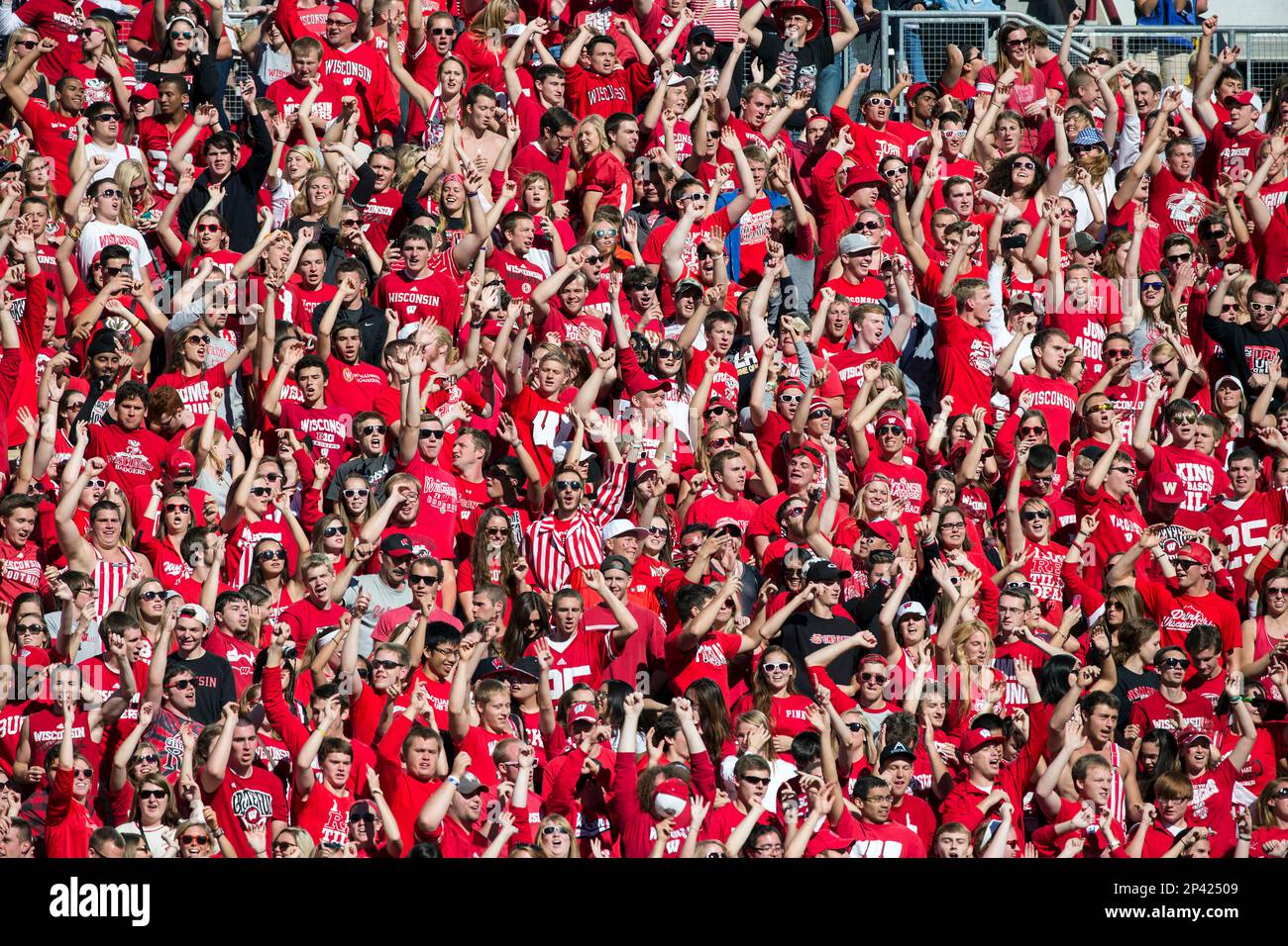Wisconsin Badger fans dance to the song "Jump Around" during an NCAA ...