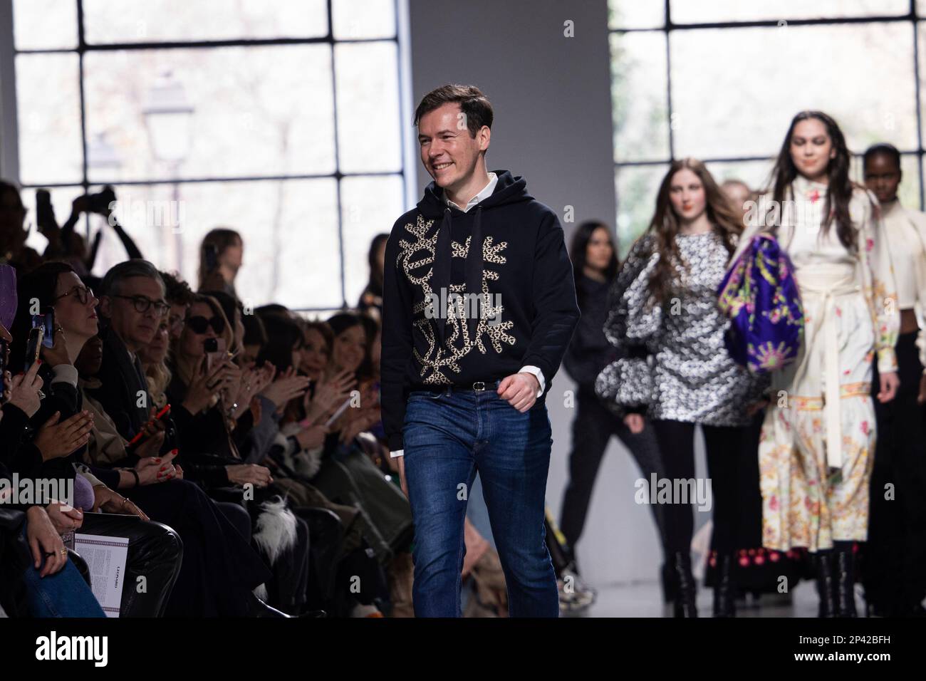 Designer Georg Lux accepts applause after the Leonard Fall/Winter 2023 ...