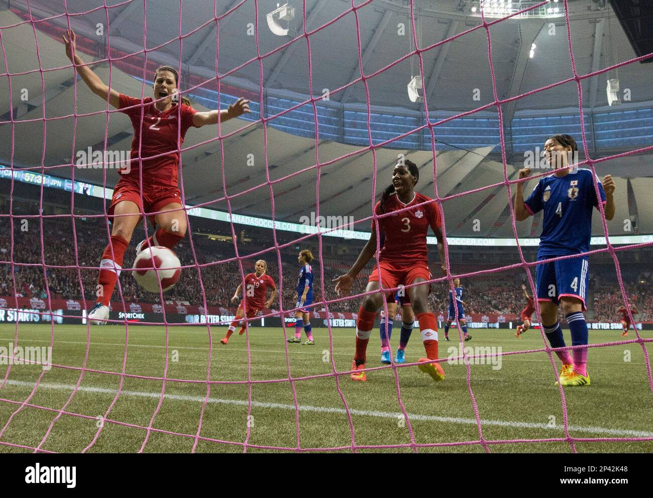 Team Canada's Emily Zurrer, left, and Kadeisha Buchanan, center ...