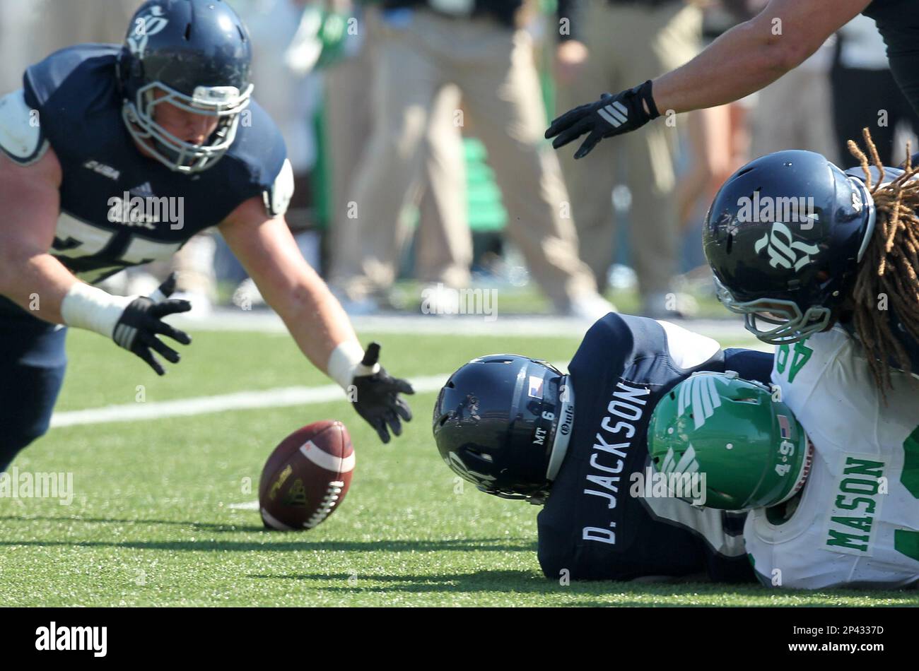 North Texas defensive end Daryl Mason (49) sacks Rice quarterback ...