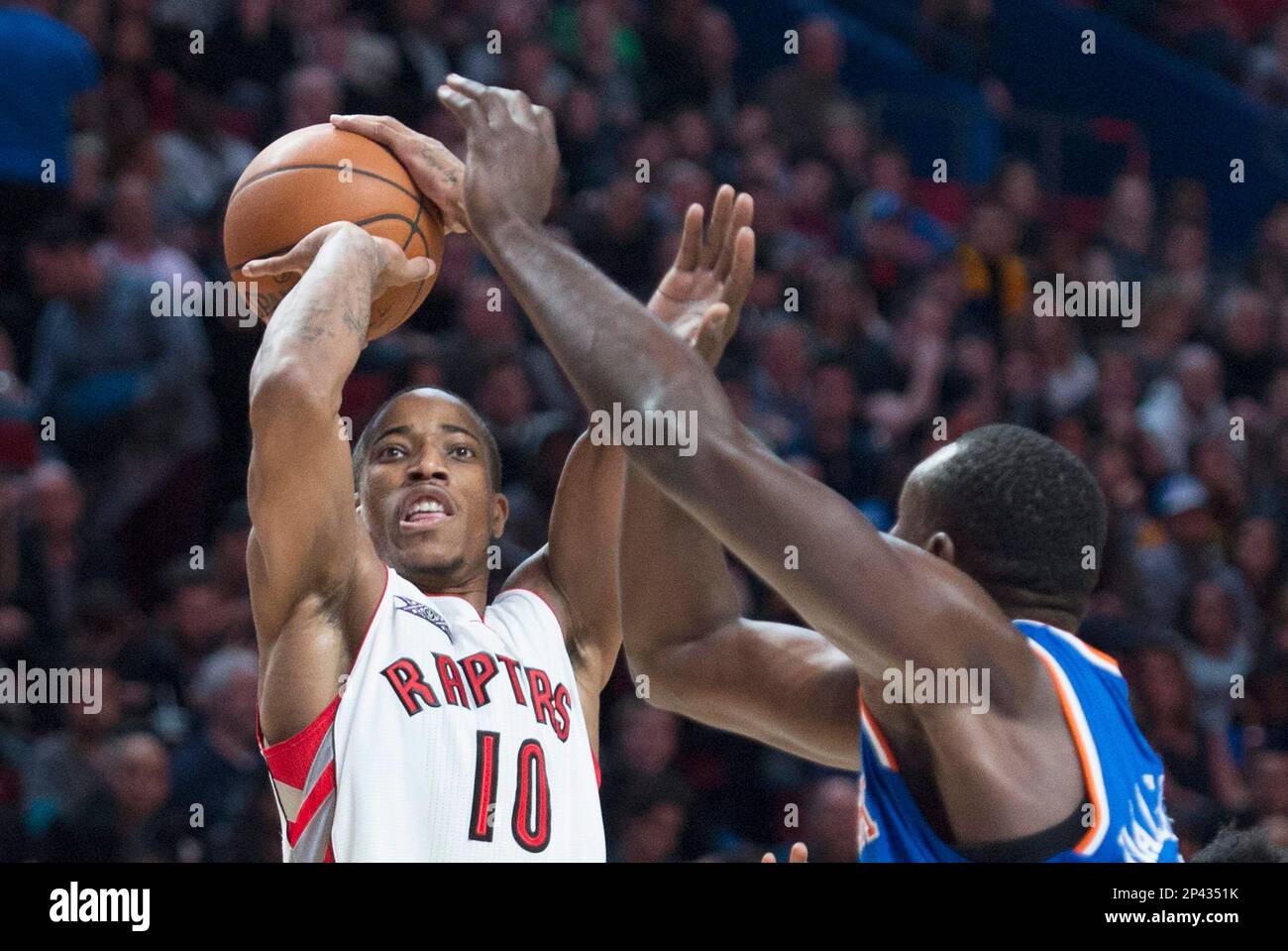 Toronto Raptors' DeMar DeRozan (10) shoots as New York Knicks' Samuel ...