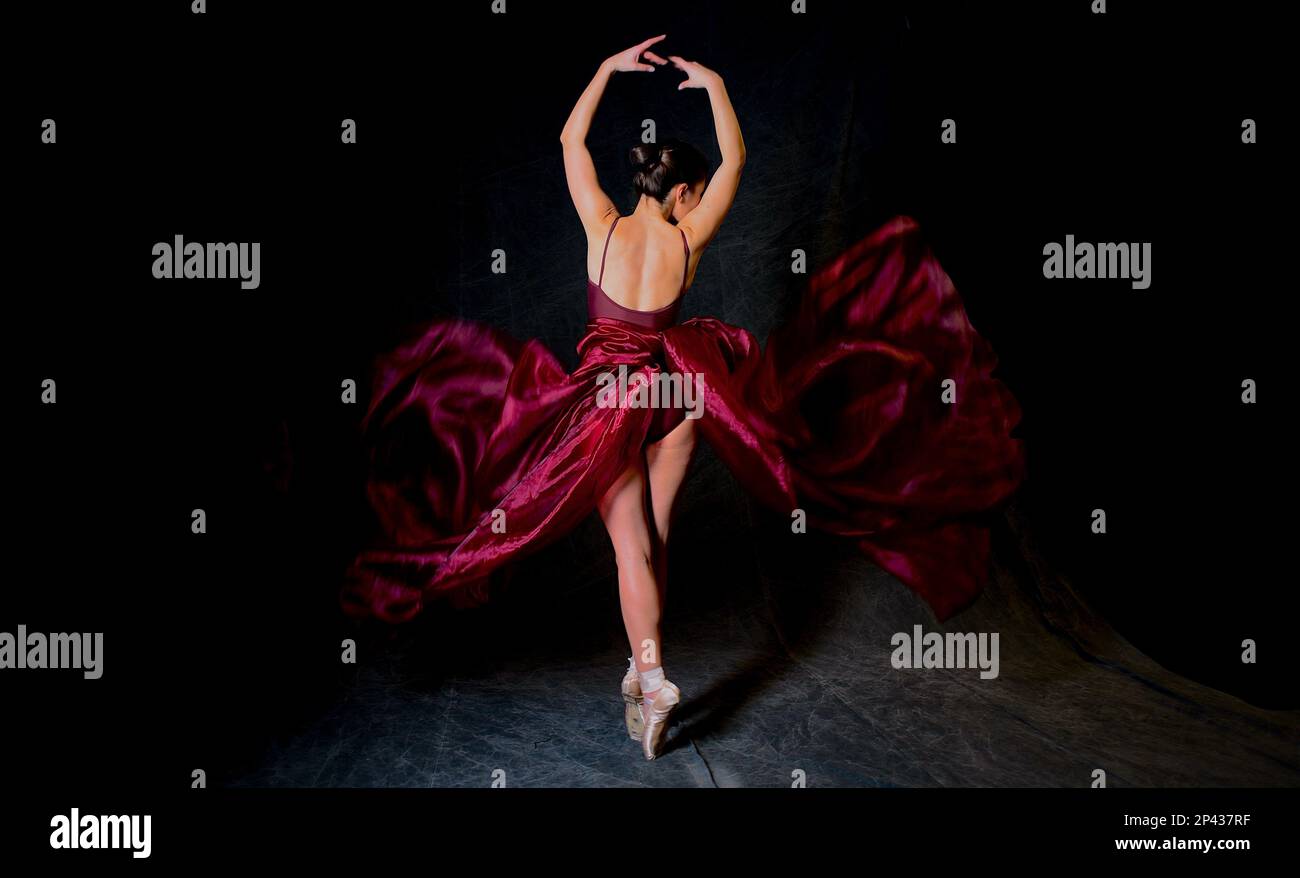 The beauty of a ballerina in motion, as she gracefully dances across ...