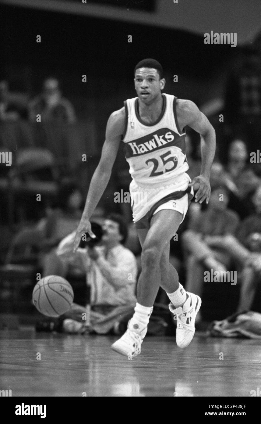 Glen (Doc) Rivers, #25 of the Atlanta Hawks dribbles up court.Circa the ...