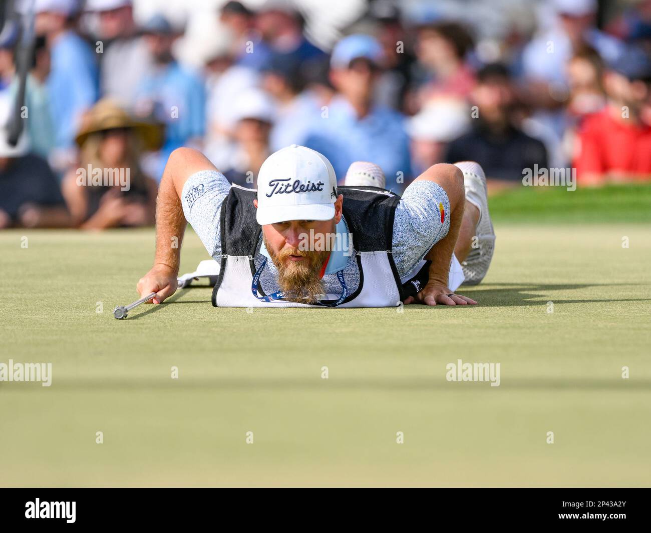 Orlando, FL, USA. 5th Mar, 2023. Max Homa caddie Joe Greiner gets low ...