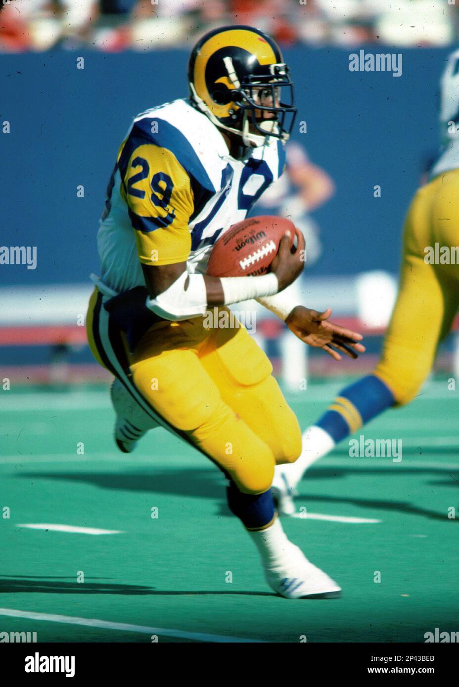 Running back Eric Dickerson #29 of the Los Angeles Rams carries the ...