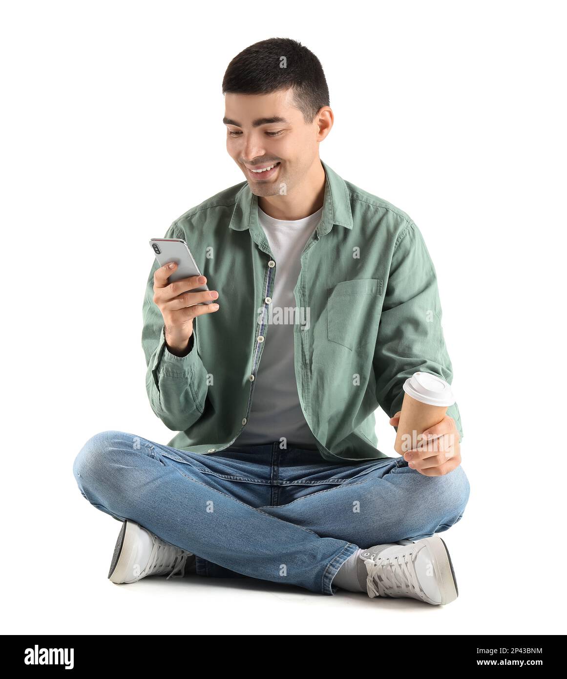 Young guy using mobile phone on white background Stock Photo - Alamy