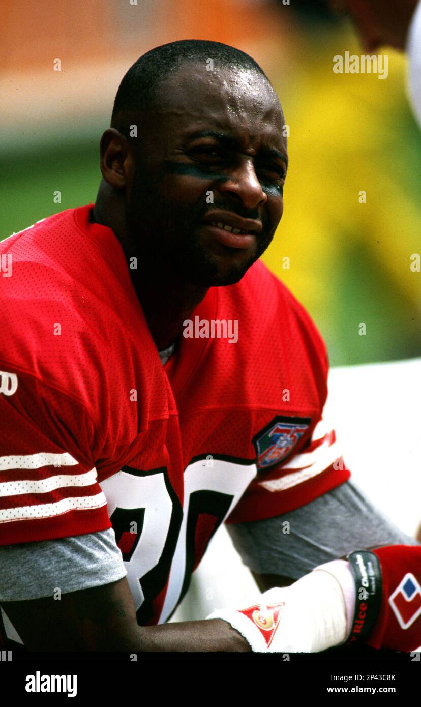 Jerry Rice #80 of the San Francisco 49ers watches the action from the ...