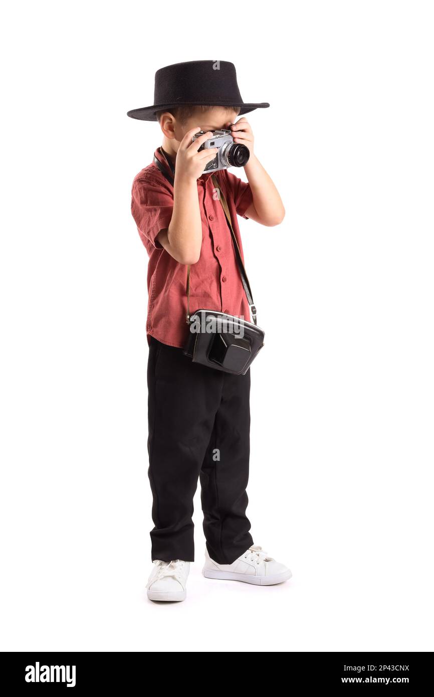 Cute little photographer with camera on white background Stock Photo ...