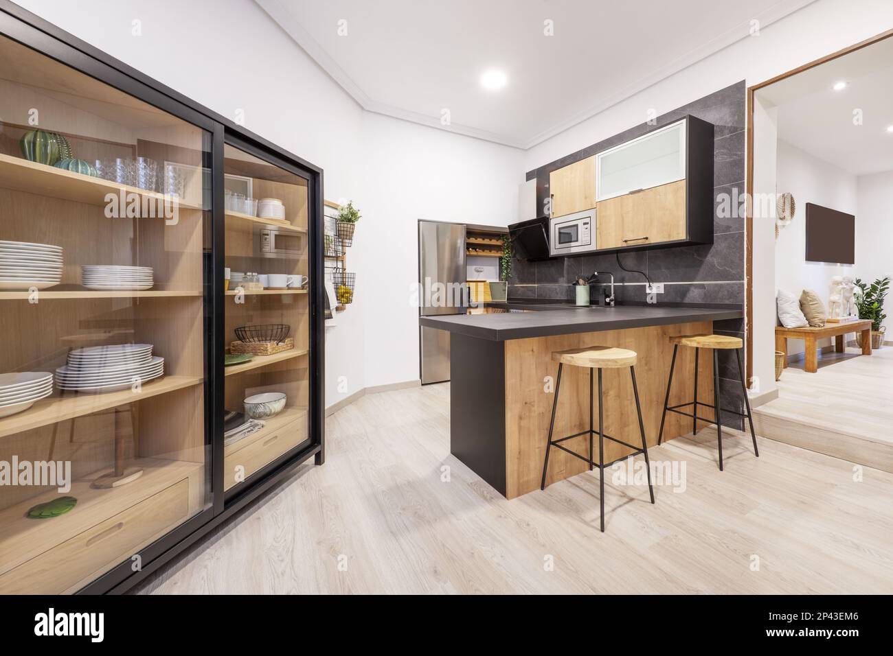 Modern style kitchen with wooden furniture combined with black, a ...