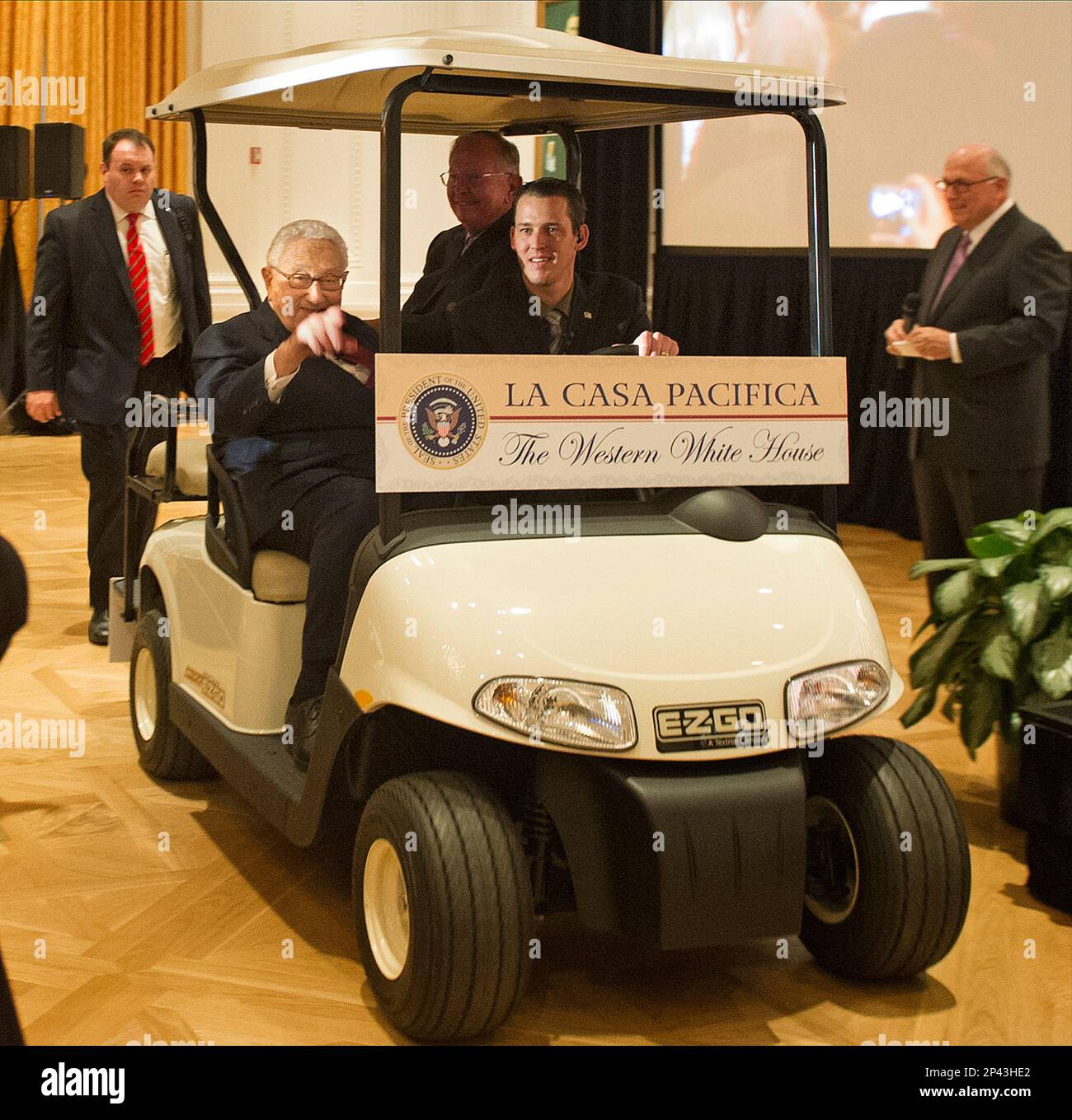 Dr. Henry Kissinger, left, enters the Nixon Presidential Library ...