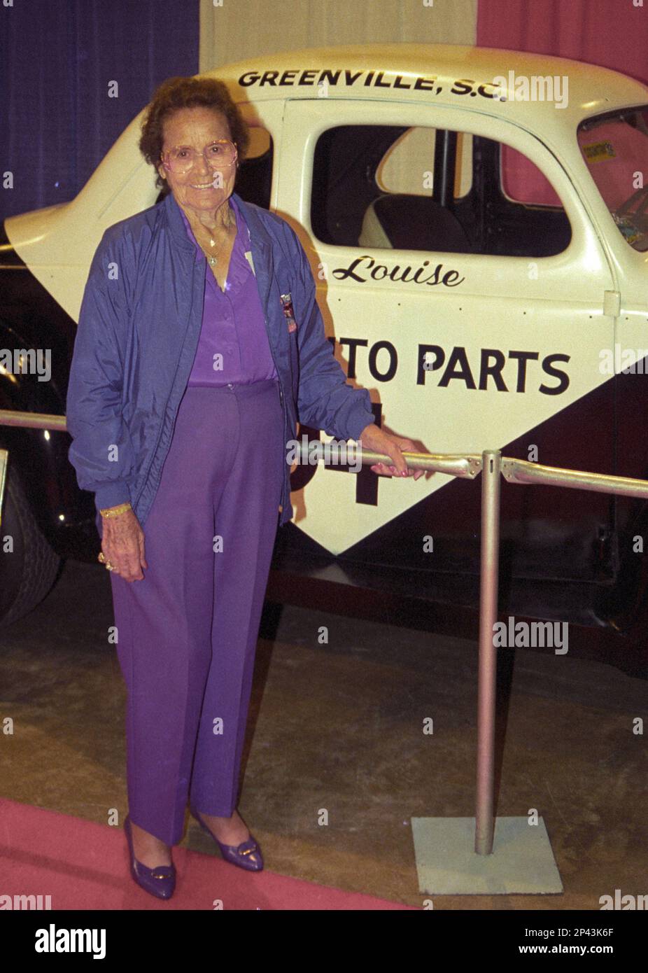 NASCAR FILE: Louise Smith posing with her old race car in Daytona Beach ...