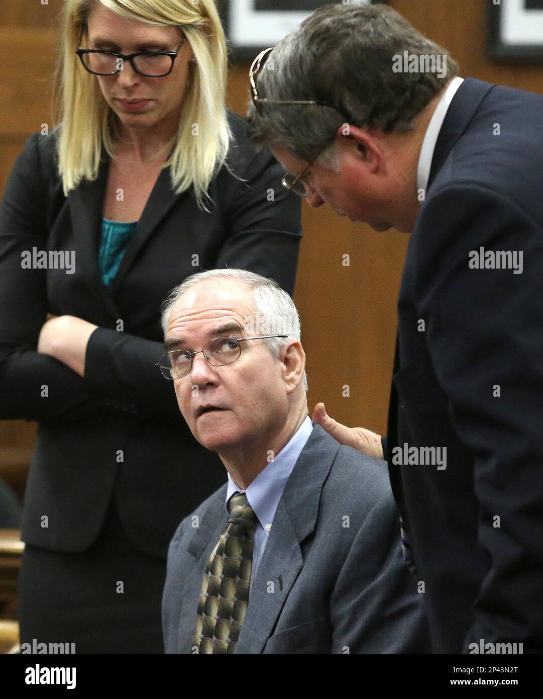 Ed Graf, center, looks at Don Youngblood, right, as defense attorney ...