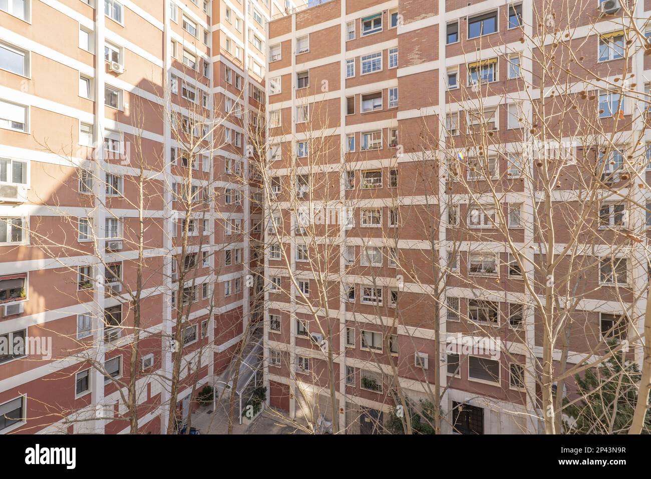 Facades of various beehive-like urban residential buildings with ...