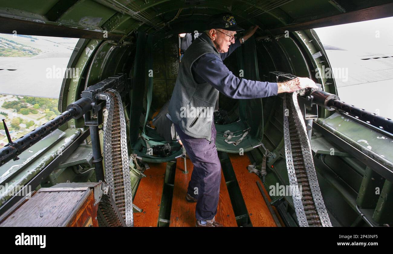 World War II veteran Jack Hunter stands in the waist gunner position in ...