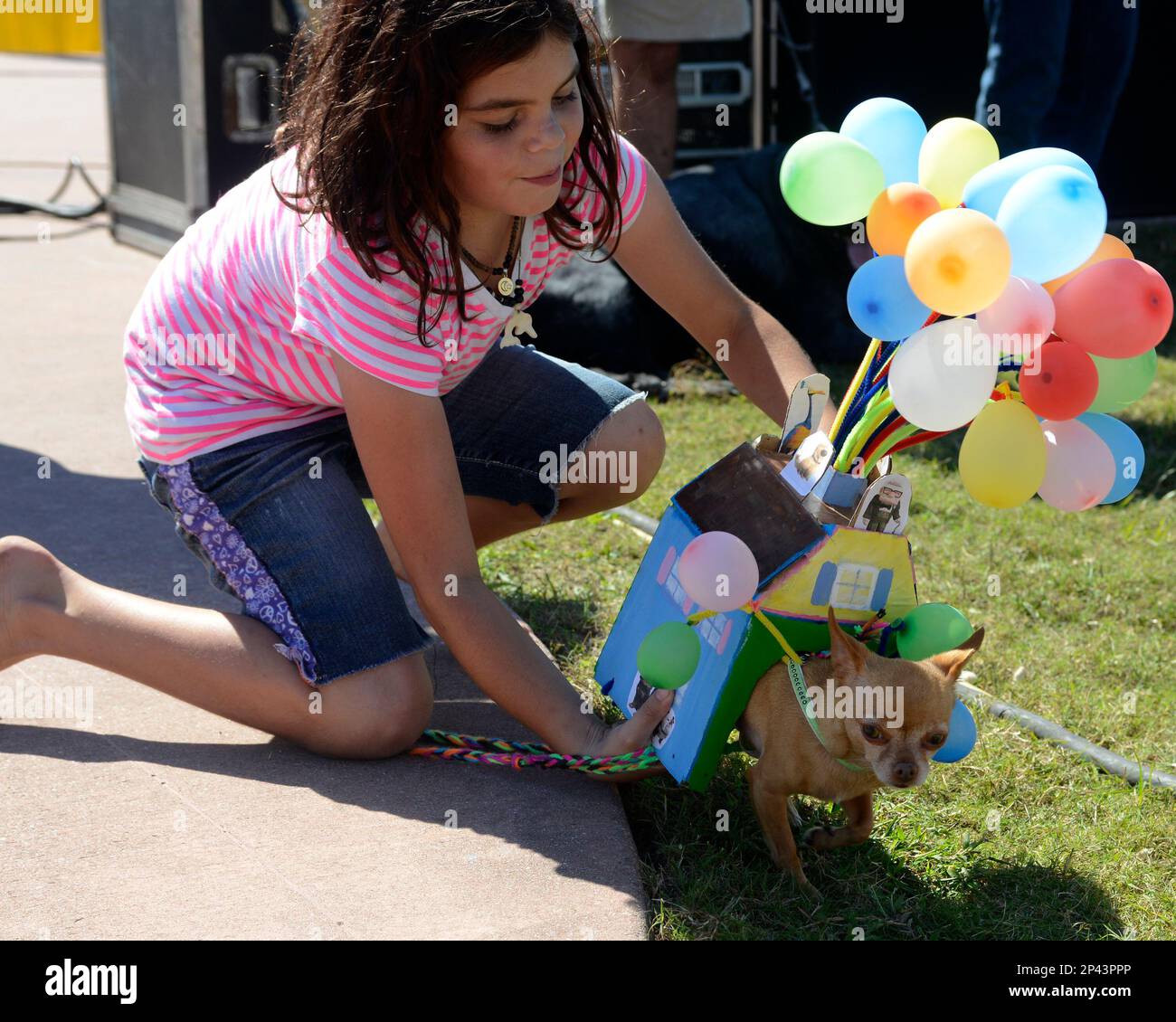 In this Saturday, Oct. 18, 2014 photo, Emma Peralta, left, helps Elby ...