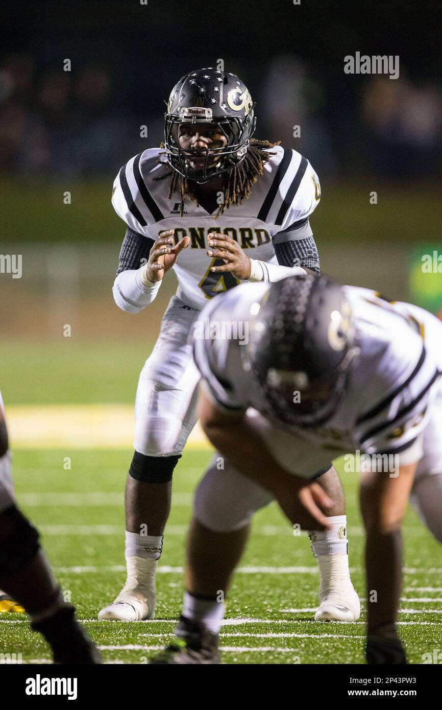 Rocky Reid (4) of the Concord Spiders lines up behind center in the ...