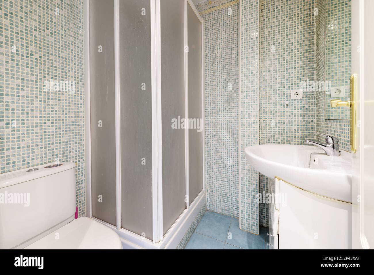 Bathroom with white porcelain sink, marble countertop, chrome taps ...