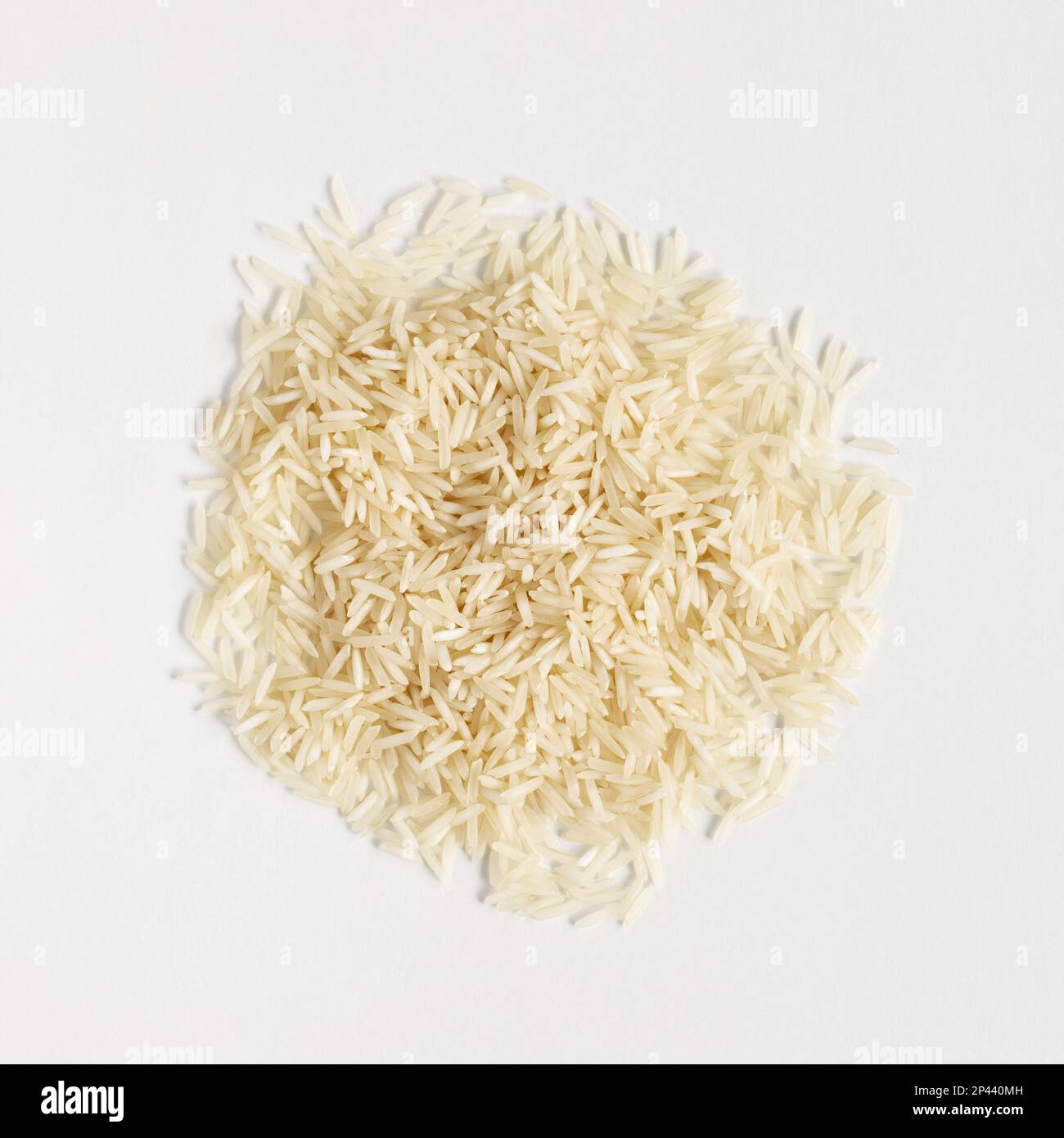 Basmati long rice on white background, top iew Stock Photo - Alamy