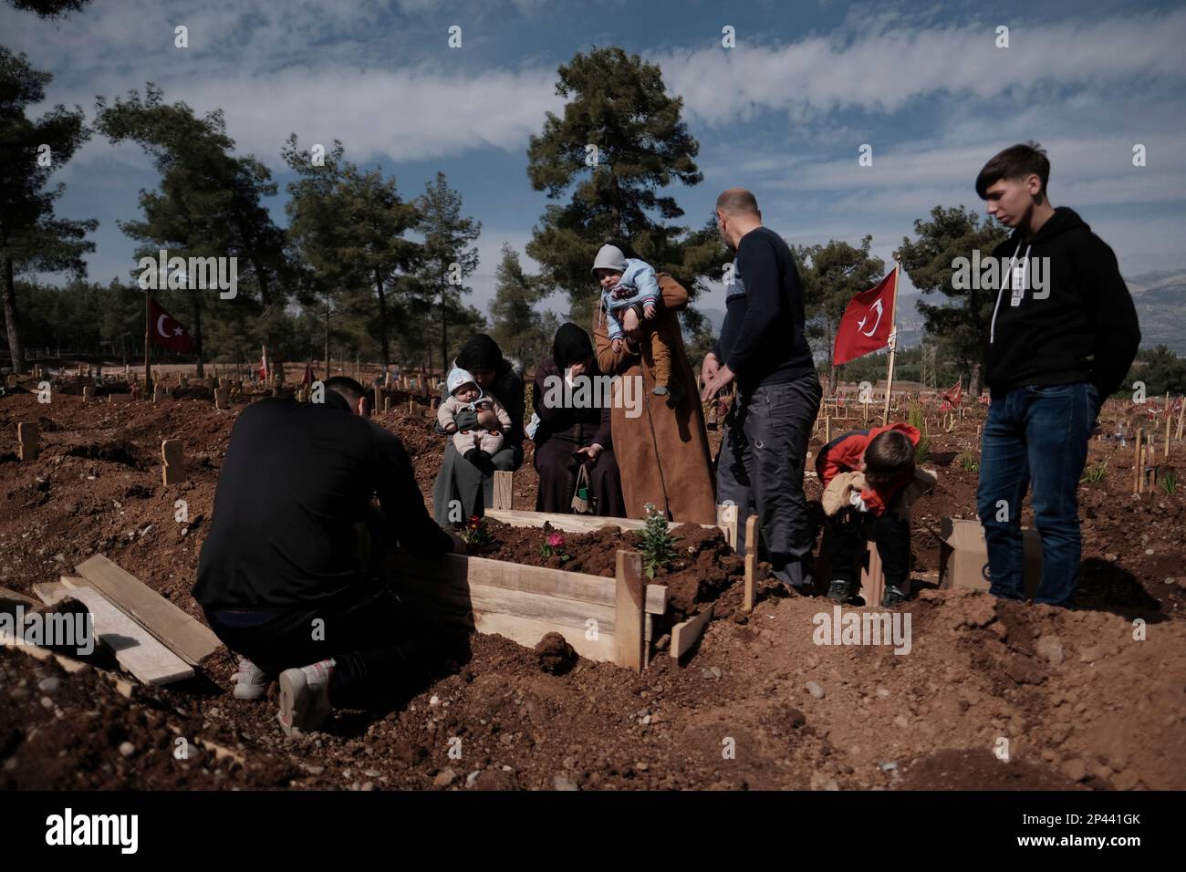 A 1-year-old boy visits the grave of his mother, who died at a ...