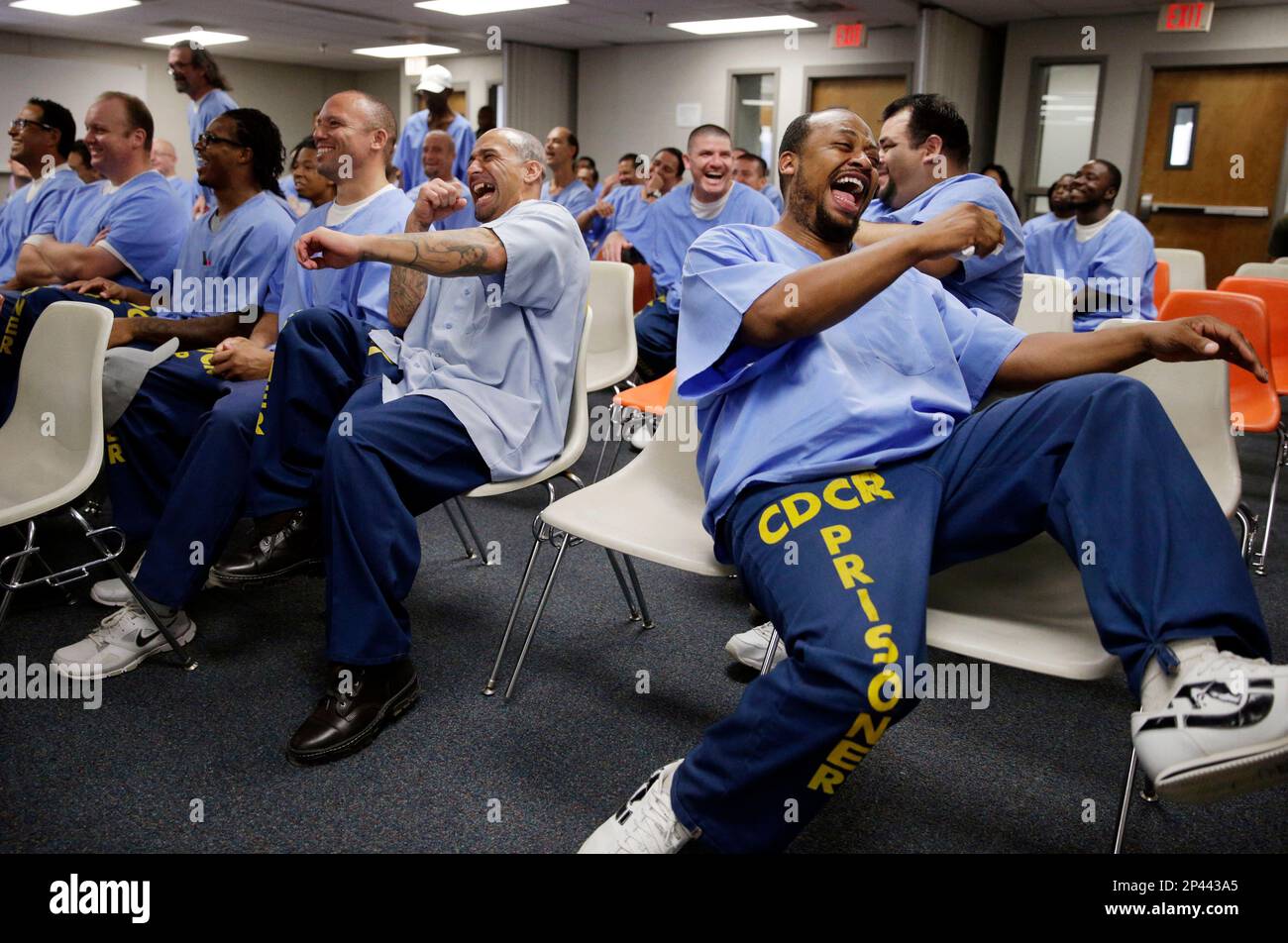 In this Sept. 30, 2014 photo, inmates laugh while watching inmate ...