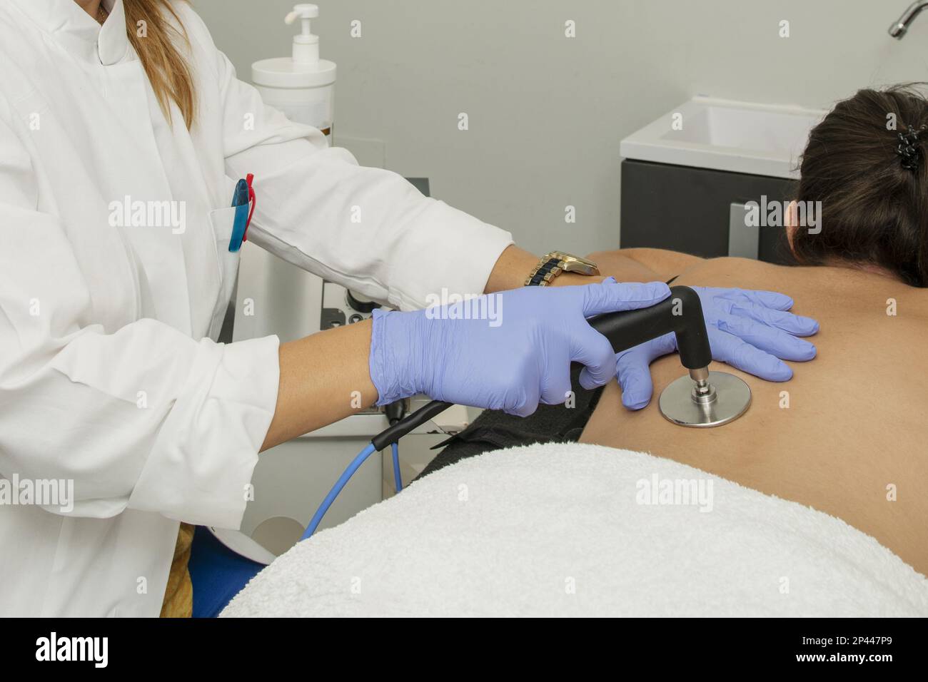 A technique from a beauty salon applying dermo-aesthetic treatments on ...