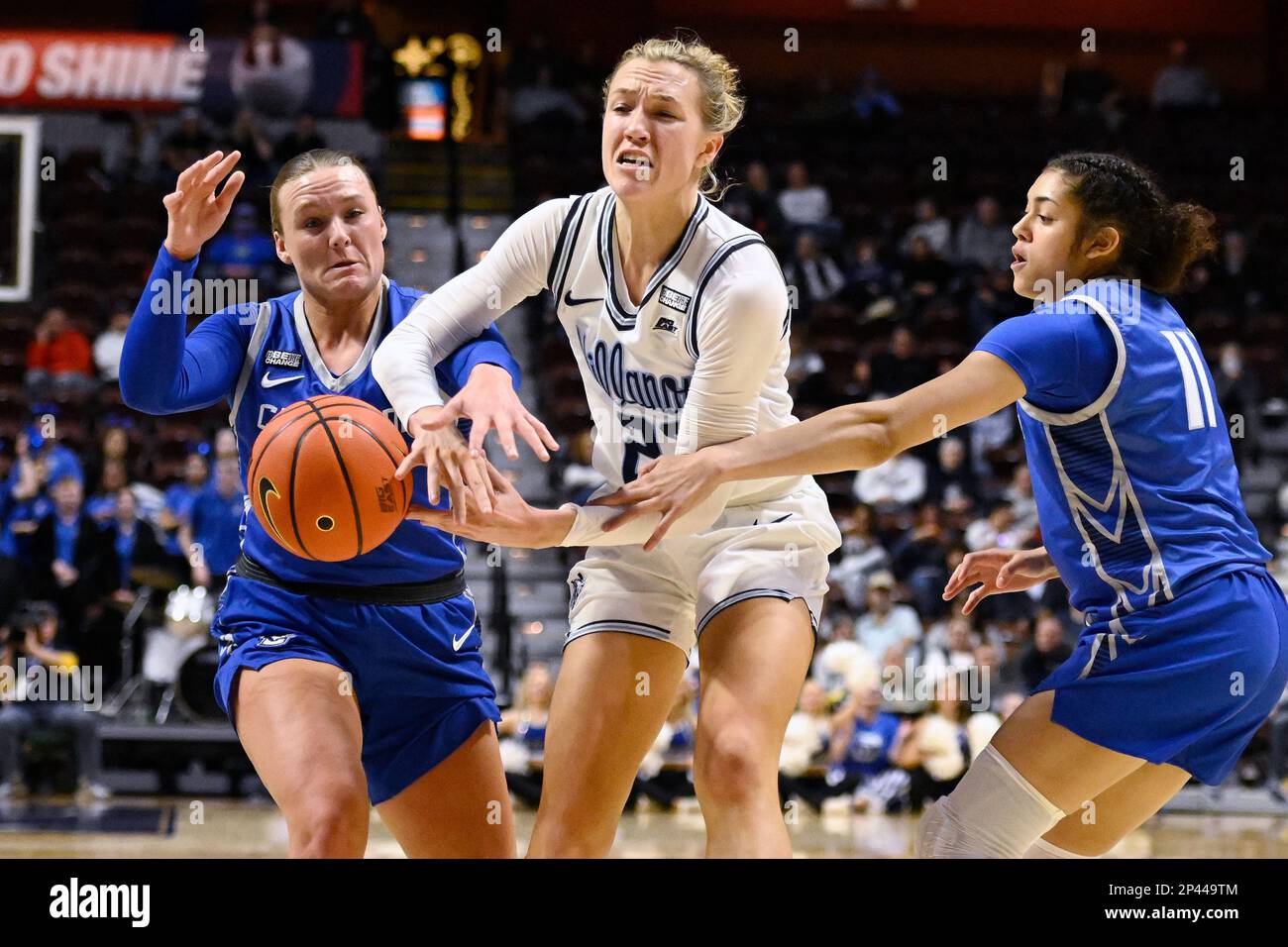 Villanova's Maddie Burke, center, loses the ball under pressure from ...