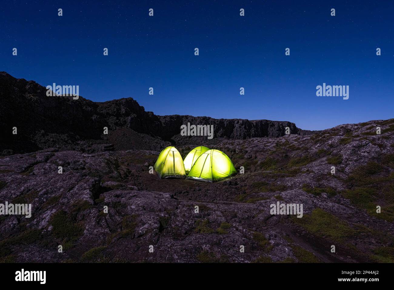 Camping tents seen at night in the Pico mountain crater, in the Azores ...