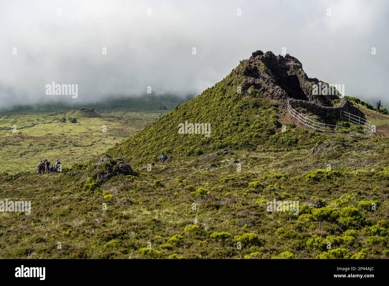 Hikers seen exploring the Pico mountain, in the Azores. Pico Island is ...