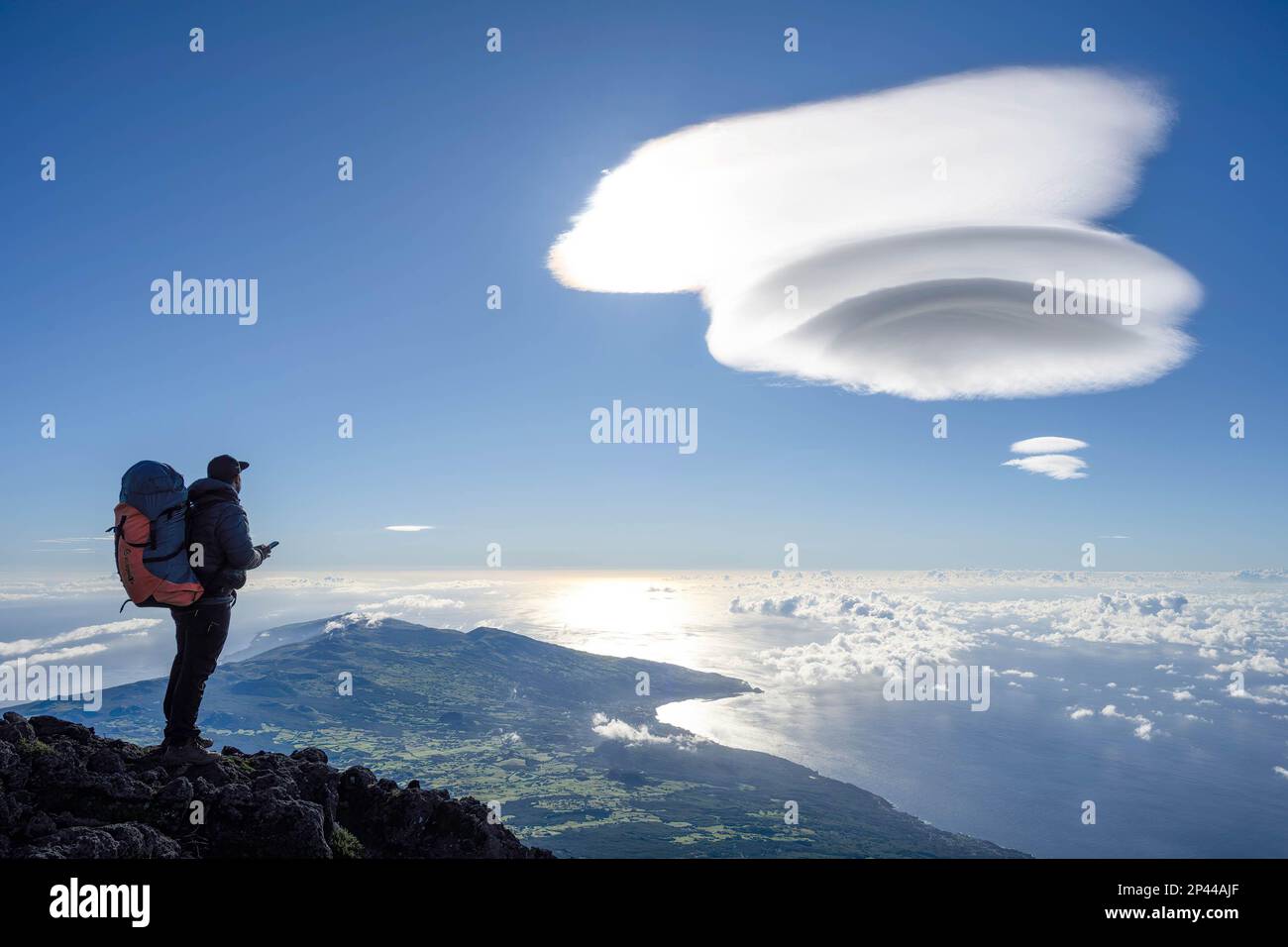 A hiker is seen exploring the Pico mountain, in the Azores. Pico Island ...