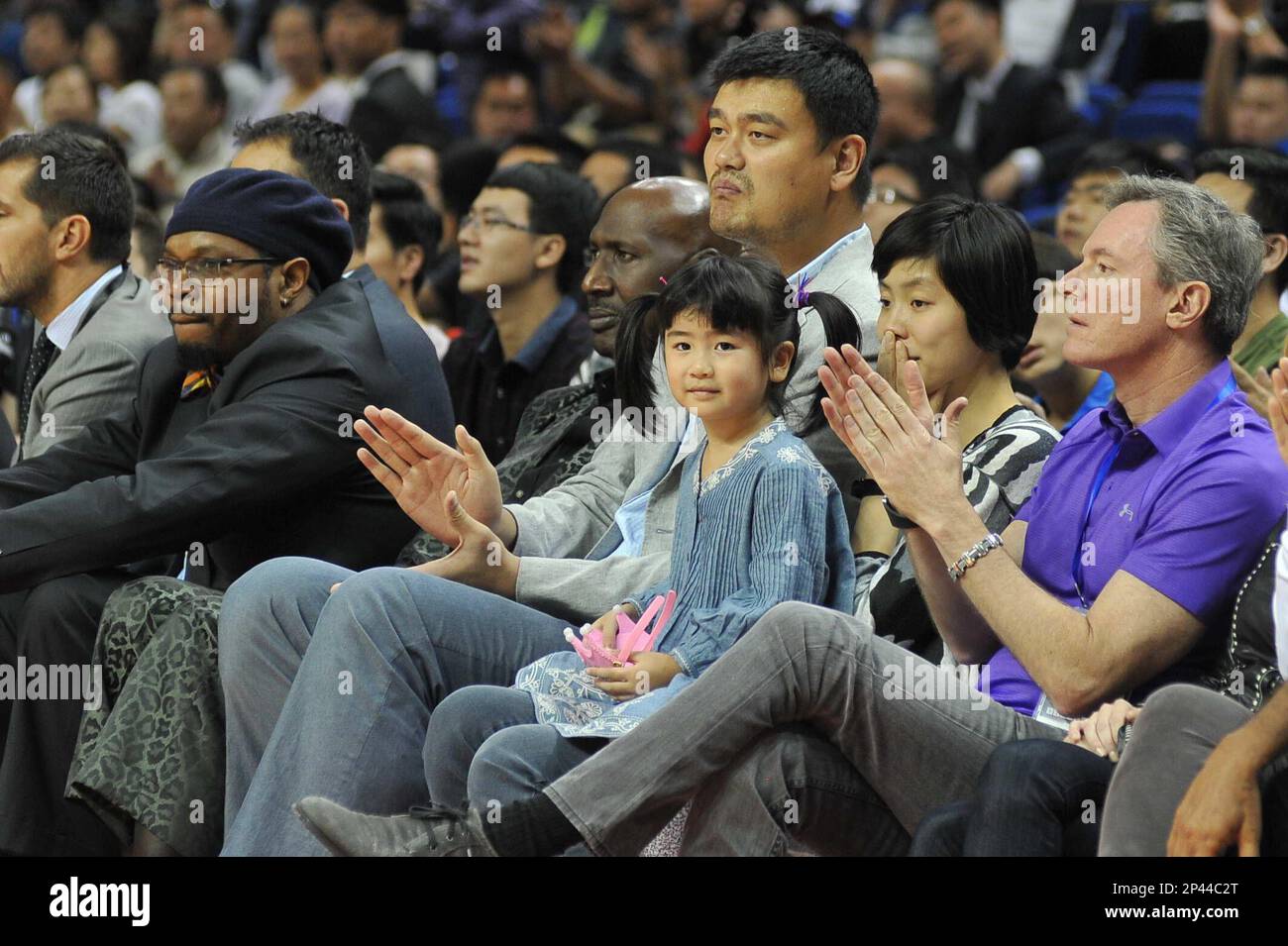 Retired Chinese basketball star Yao Ming, fourth right, his wife Ye Li ...