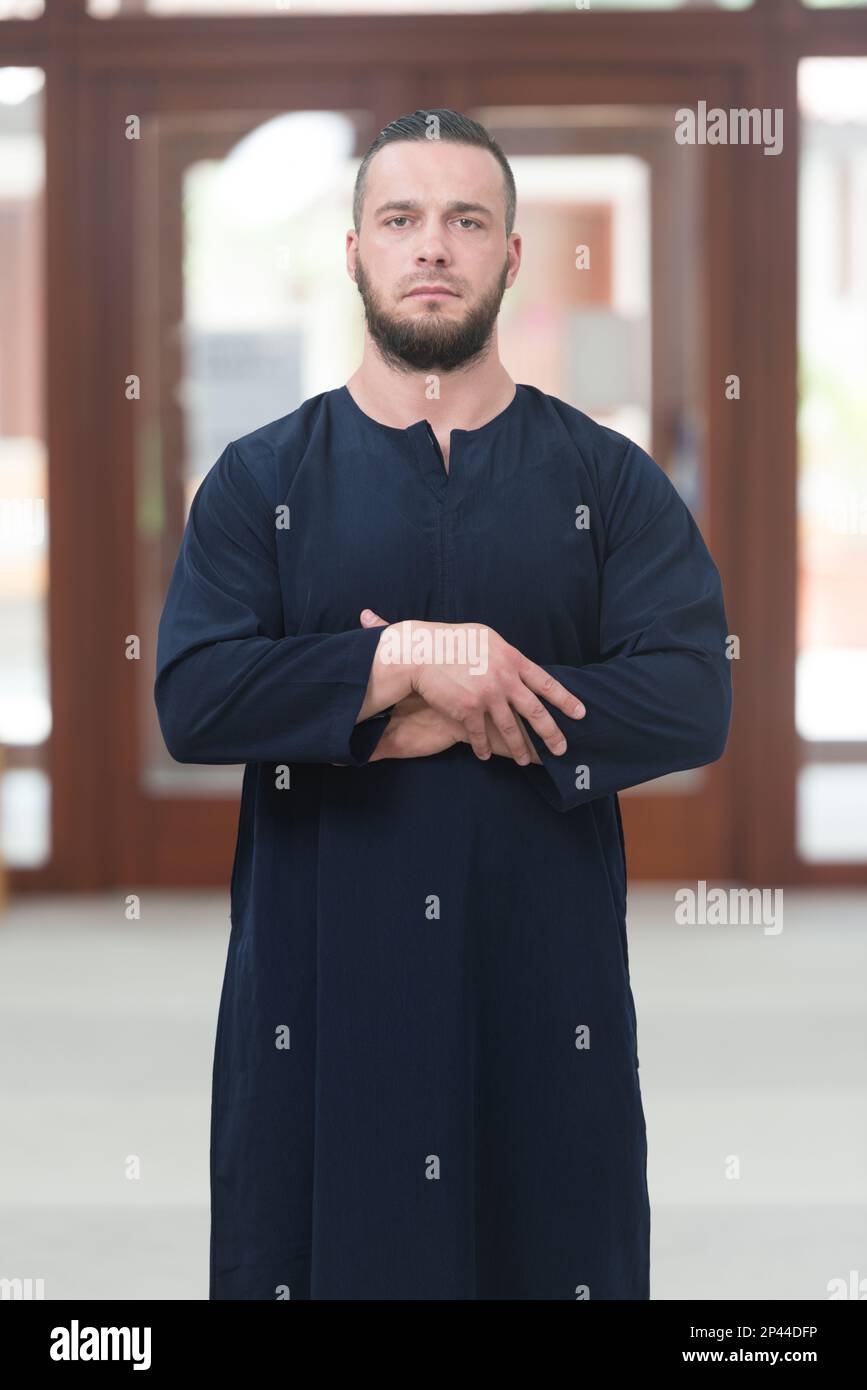 Young Muslim Man Making Traditional Prayer To God Allah While Wearing A ...