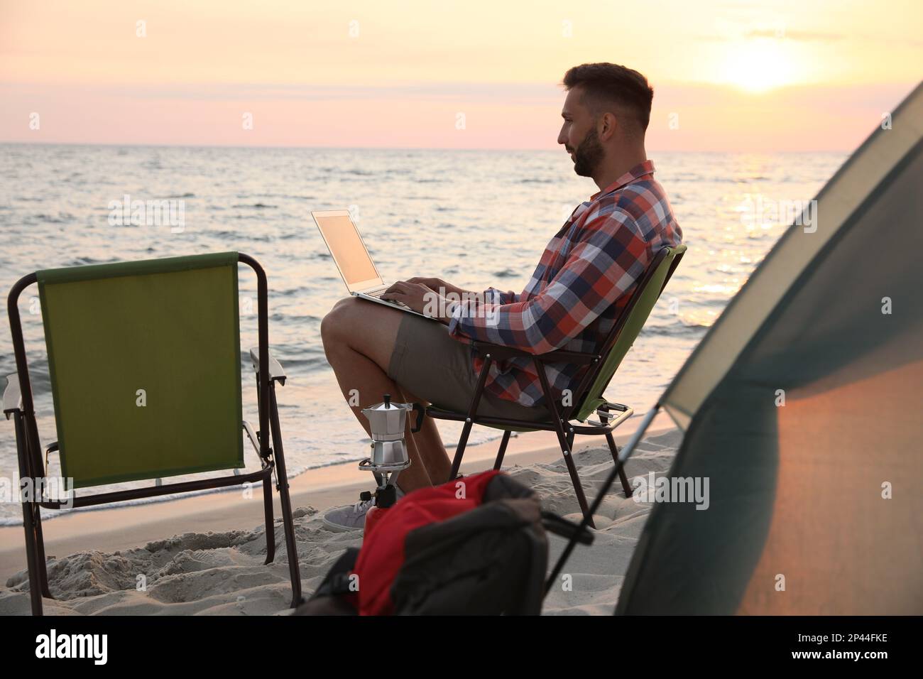 Man sitting in camp chair hi-res stock photography and images - Alamy