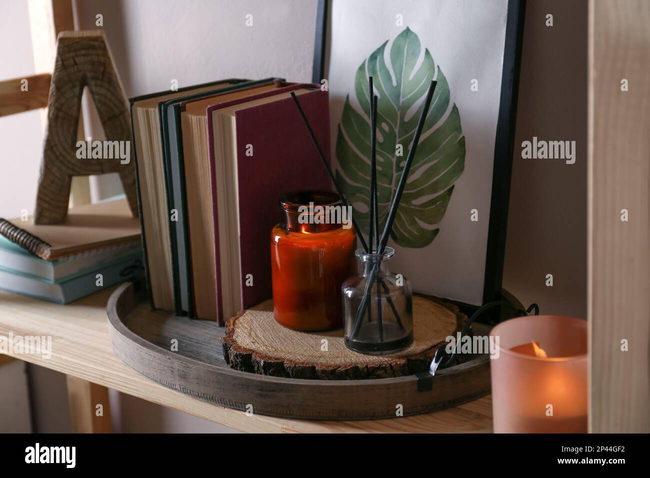 Stylish tray with different interior elements on wooden shelf Stock ...