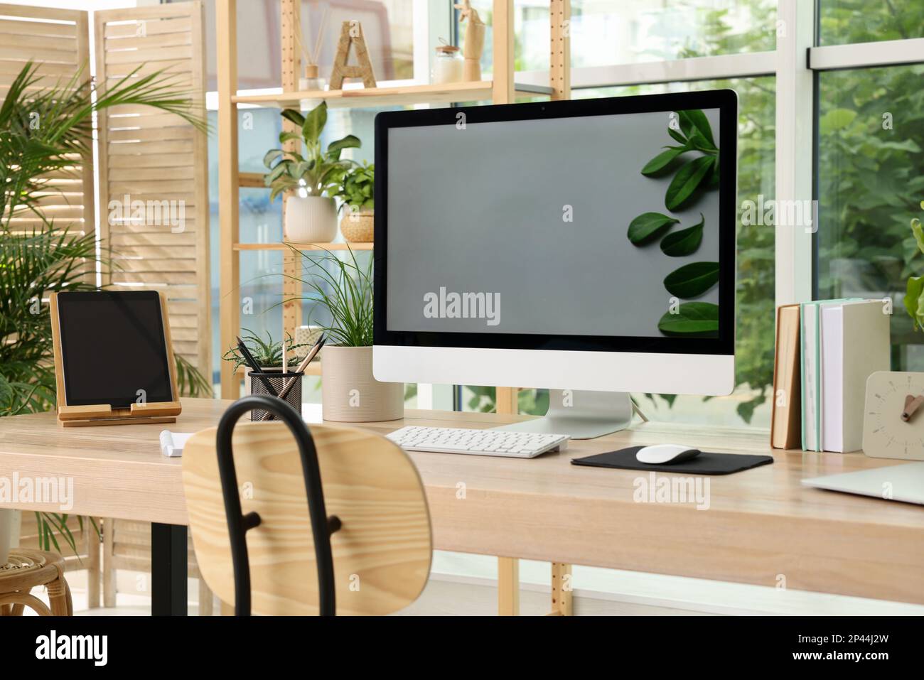 Comfortable workplace with computer in light room. Interior design ...