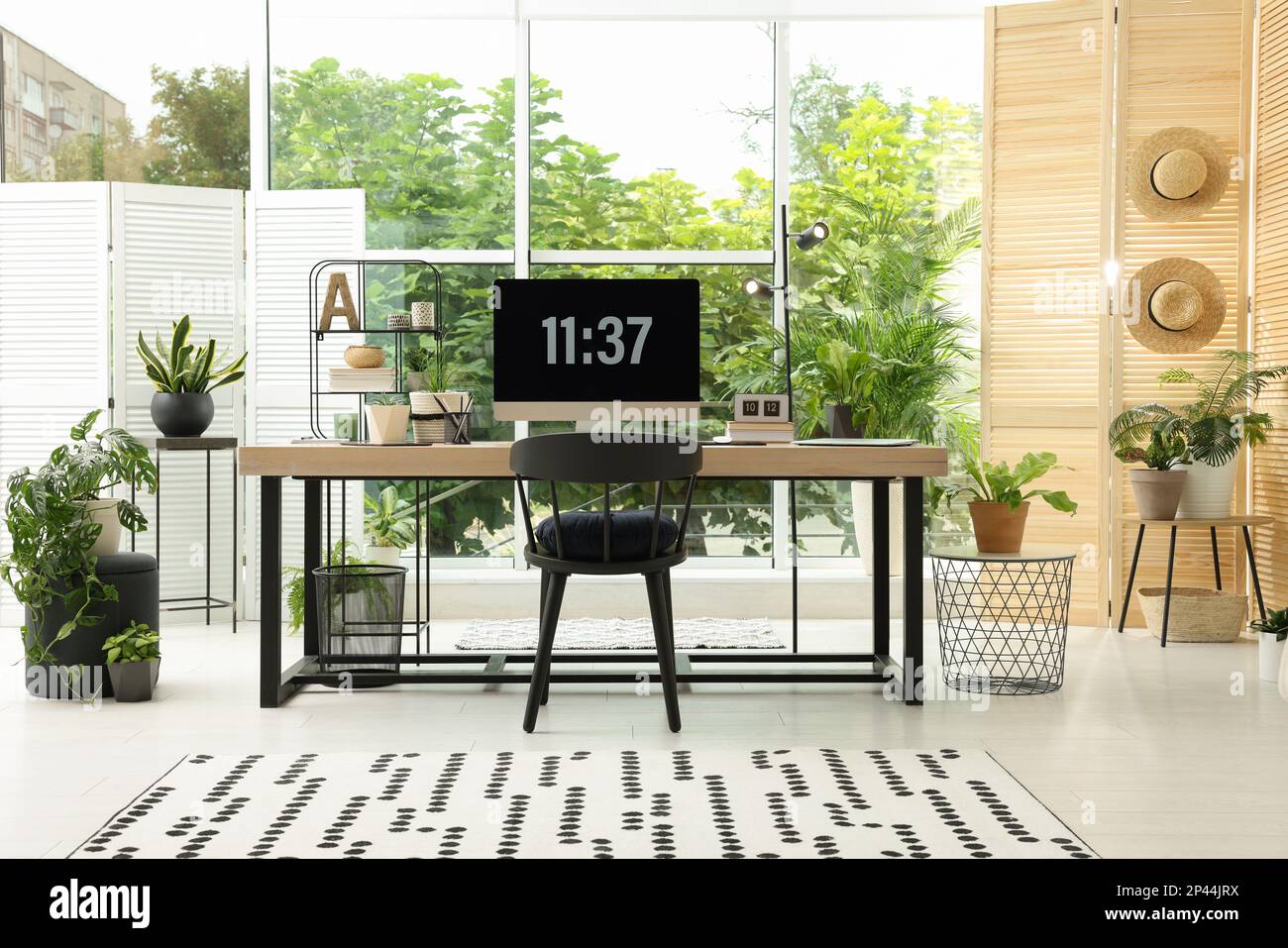 Comfortable workplace with computer in light room. Interior design ...